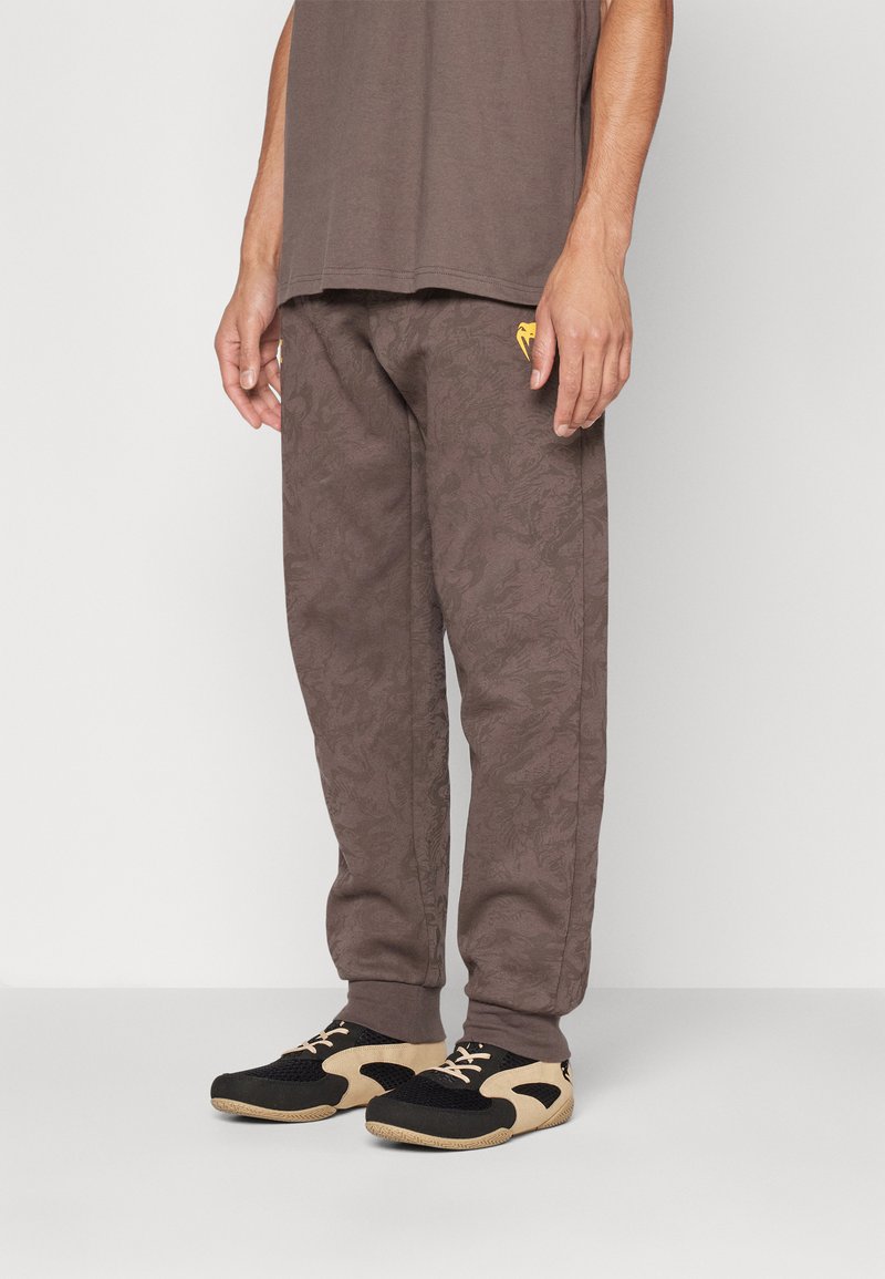 Venum UFC FIGHT WEEK MENS JOGGER - Tracksuit bottoms - dark brown ...