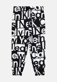 Calvin Klein Jeans GRID - Tracksuit bottoms - black/white/white ...