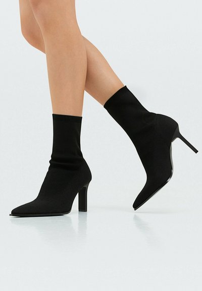 Bottes à talons | Tous les articles chez Zalando