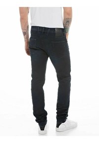 Replay ANBASS HYPERFLEX - Jeans Slim Fit - darkblue/dark-blue denim ...