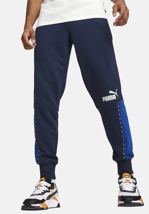 Puma CLASSICS BLOCK - Pantalones deportivos - persian blue warm white ...