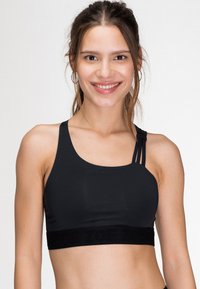 zoe IRIS - Light support sports bra - black - Zalando