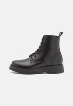 Tommy Jeans LACE UP FLAT BOOT - Platform ankle boots - black - Zalando.de