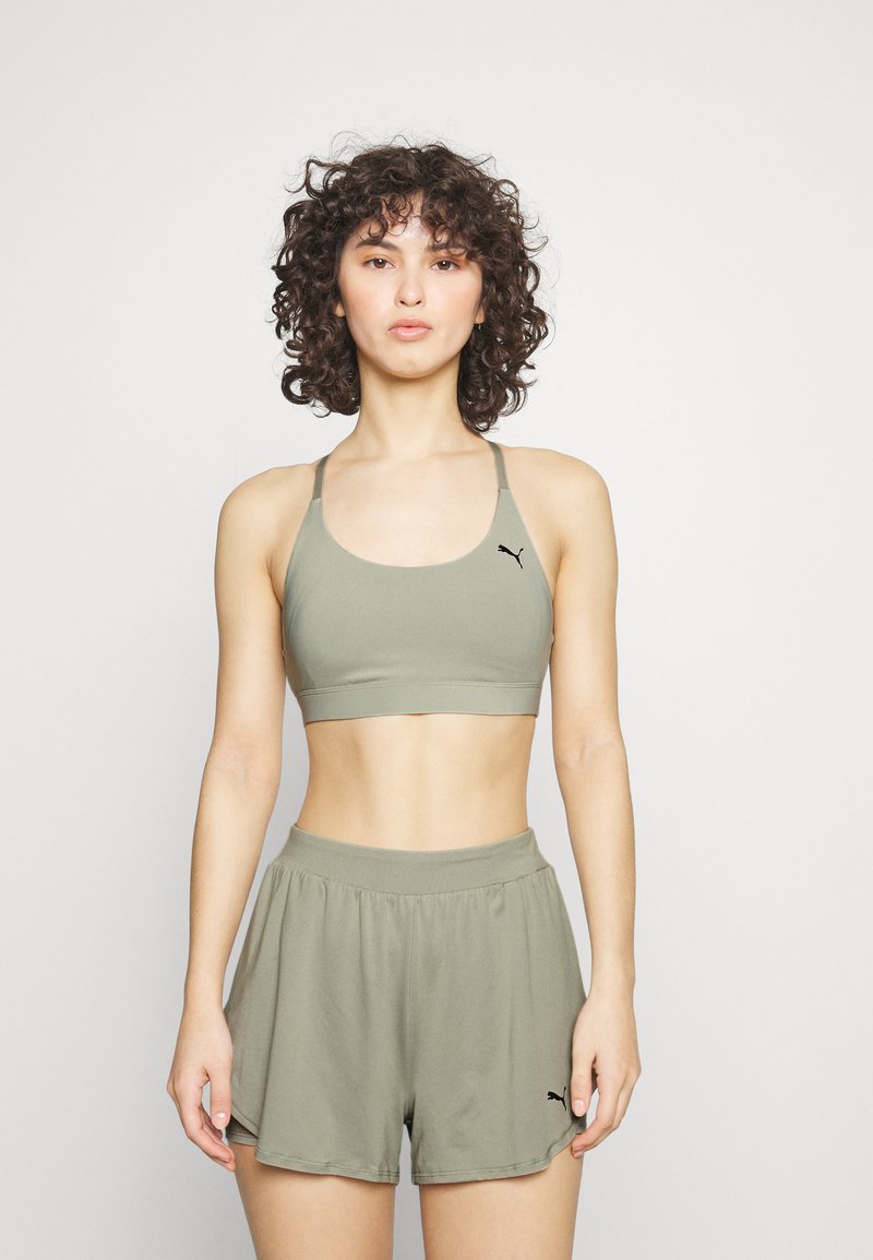 Puma STUDIO ULTRABARE STRAPPY BRA - Sport-BH med lätt stöd - birch tree ...