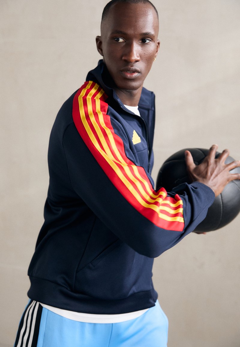 adidas Sportswear HOUSE OF TIRO NATIONS PACK TRACK - Trainingsjacke ...