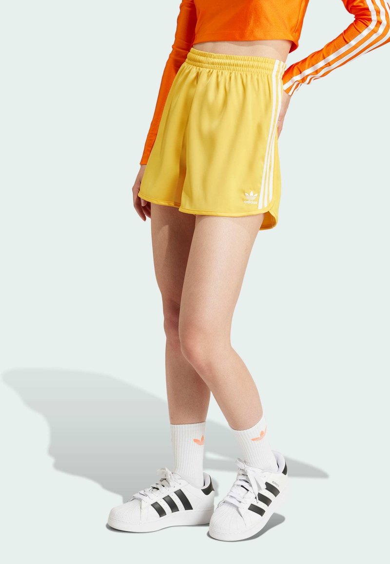 adidas Originals SATIN SPRINT - Tracksuit bottoms - bold gold/gold ...