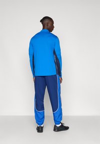 Nike Performance Pantalon de survêtement - blue void/game royal/white ...