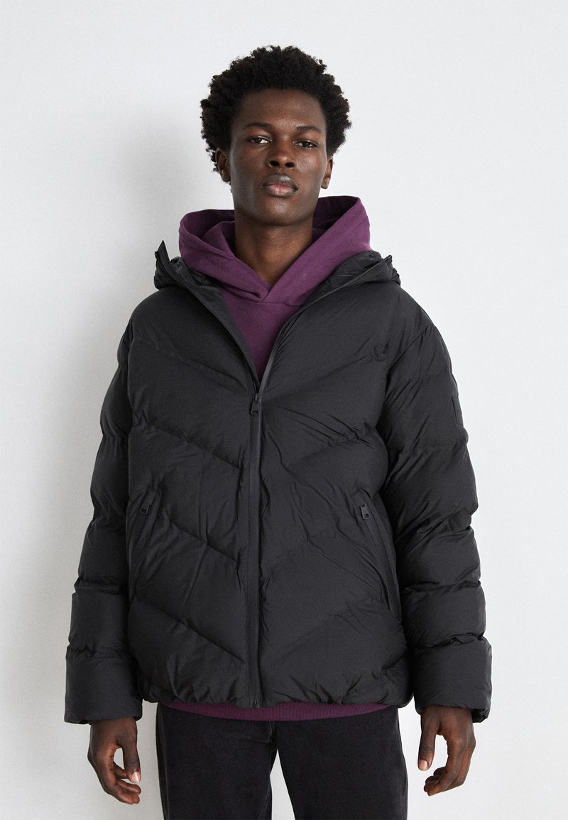 Calvin Klein STITCHLESS QUILT JACKET HOOD - Veste d'hiver - black/noir ...