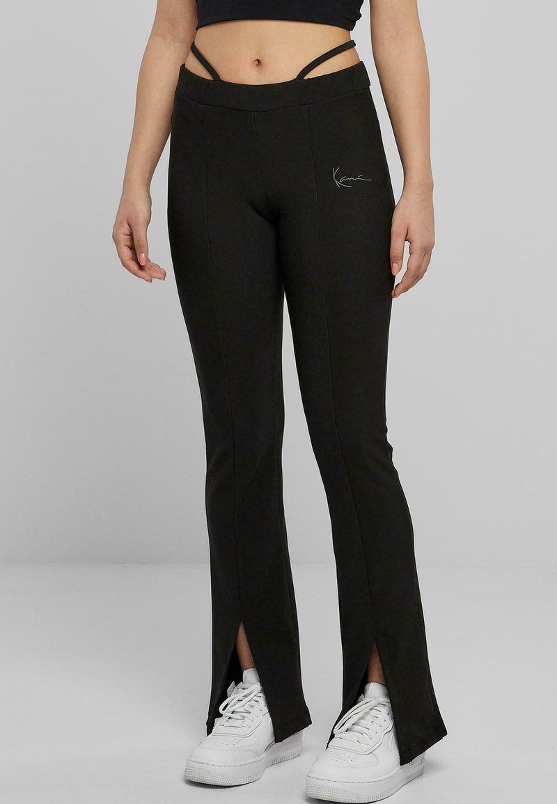 Karl Kani SMALL SIGNATURE HIP STRING - Stoffhose - black/schwarz ...