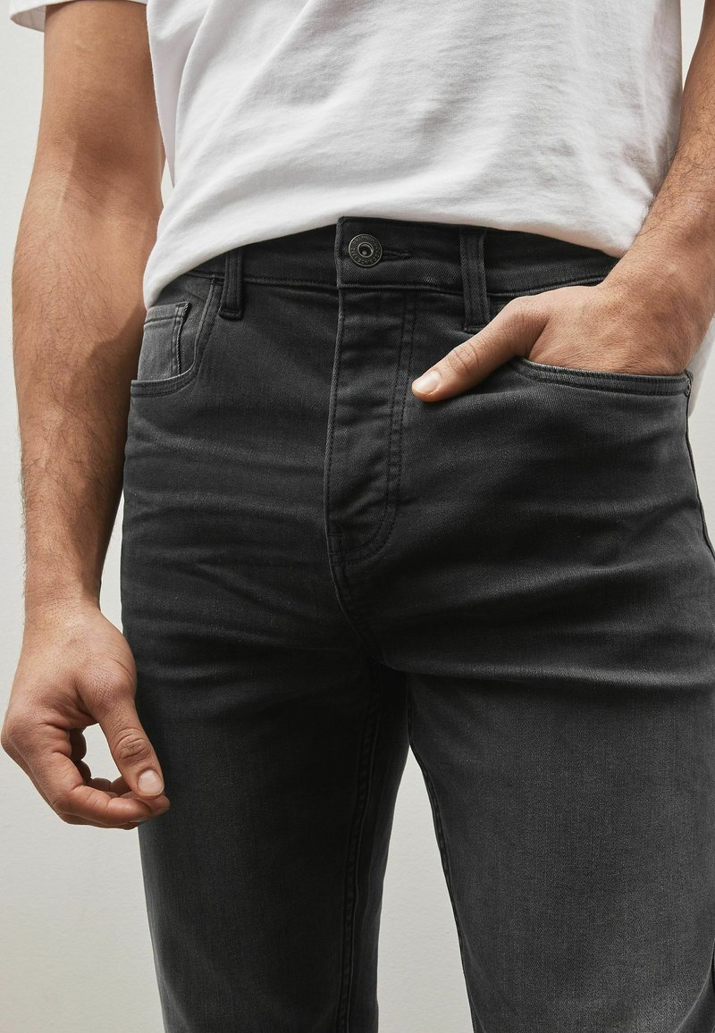 Next MOTION FLEX SOFT TOUCH - Vaqueros rectos - black/negro - Zalando.es