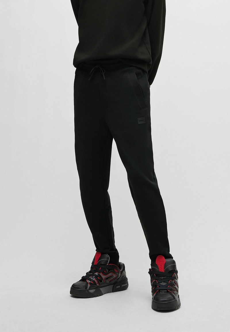 HUGO Tracksuit bottoms - black one/black - Zalando.ie