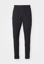 Castore JOGGERS - Tracksuit bottoms - black - Zalando