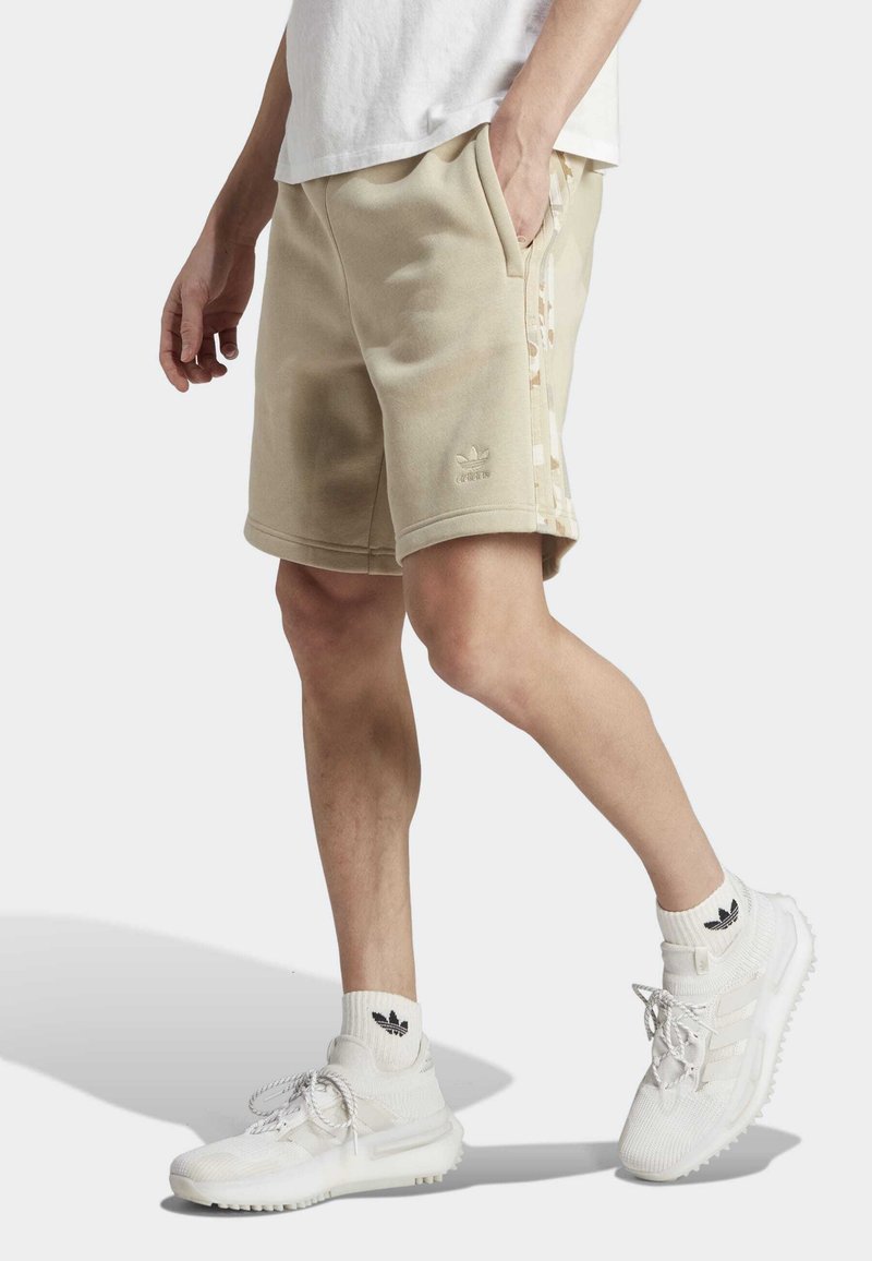 adidas Originals GRAPHICS CAMO STRIPE - Tracksuit bottoms - savanna ...