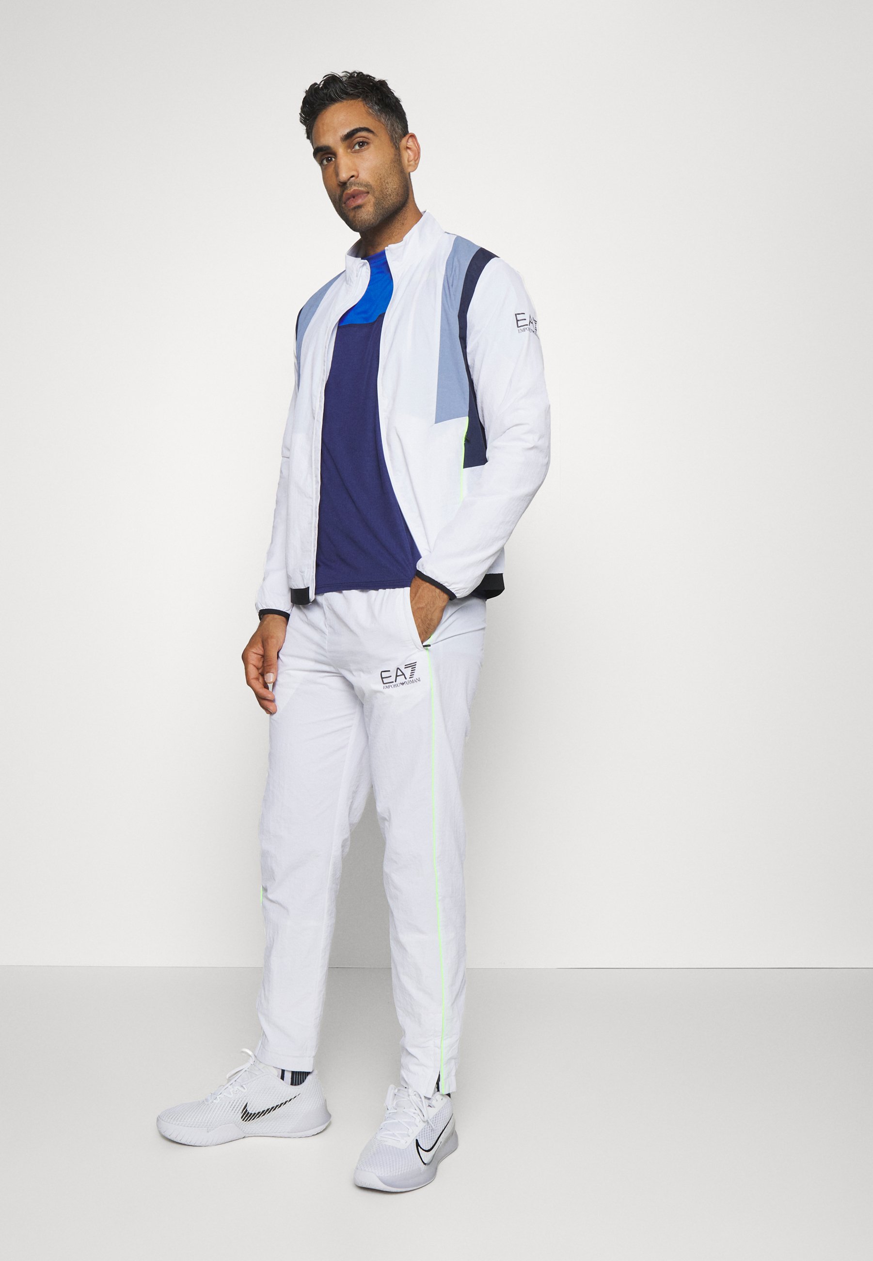 White armani suit store