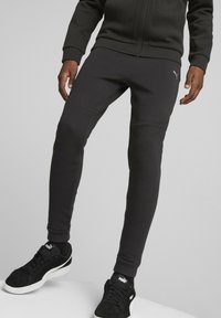 Puma TECH - Trainingsbroek - black/zwart - Zalando.nl