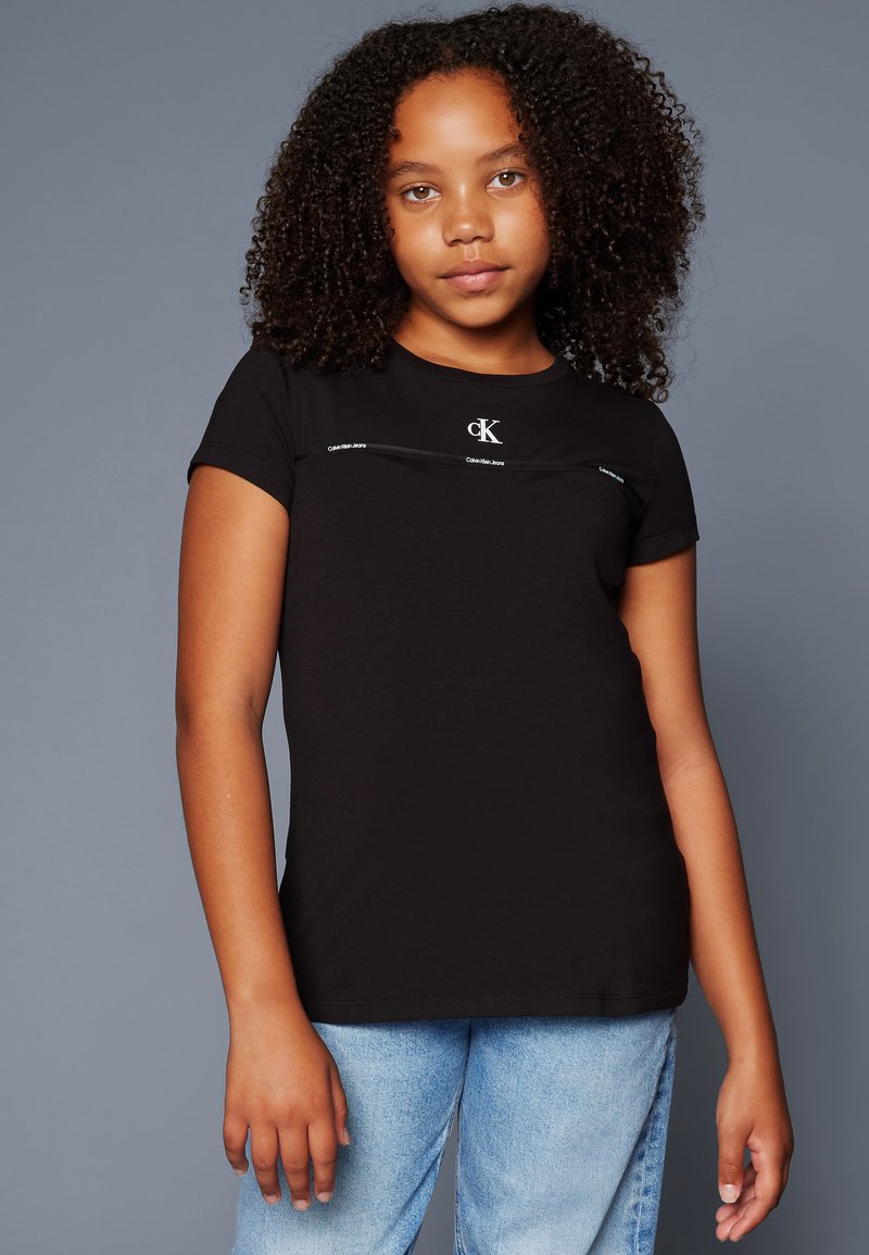 Calvin Klein Jeans PUNTO LOGO TAPE - Print T-shirt - ck black/black ...