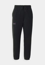 Under Armour ROCK TERRY - Jogginghose - black/schwarz - Zalando.at