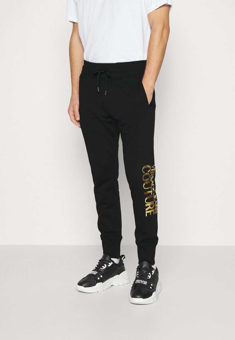 Versace Jeans Couture Pantaloni de trening - black/gold/negru - Zalando.ro