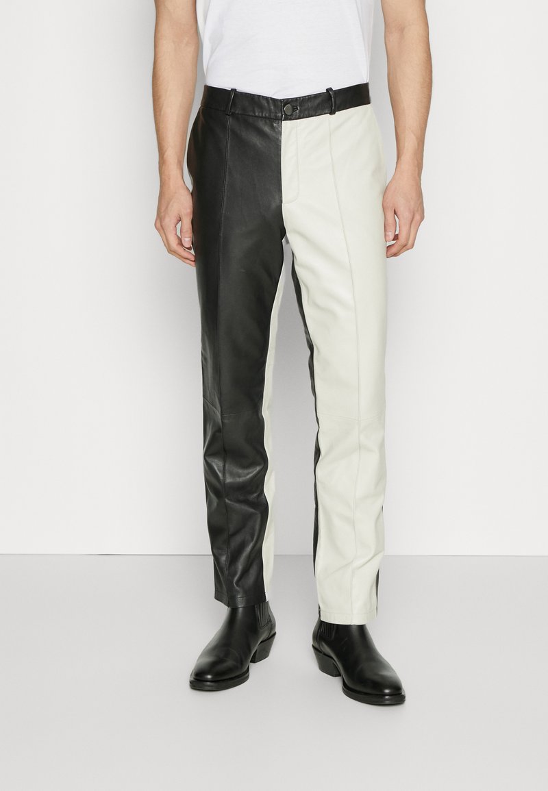 STUDIO ID BILLIE TROUSERS - Leather trousers - black/off white/black ...