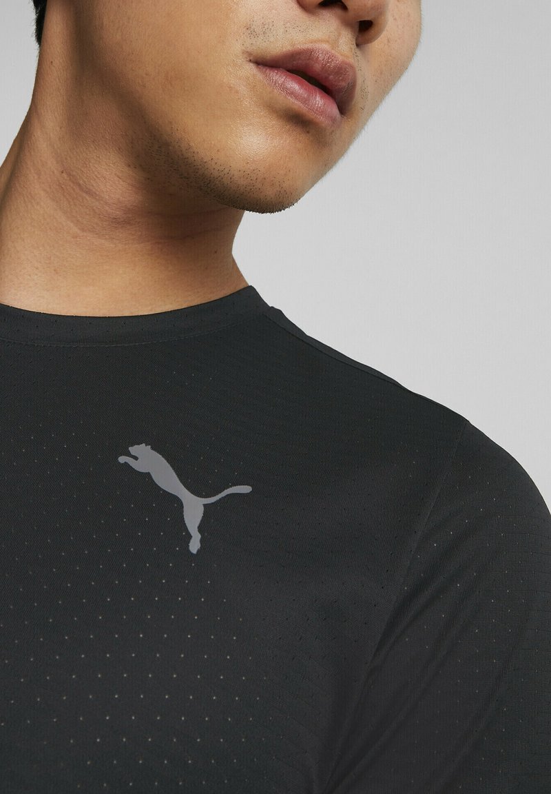 Puma TRAIN BLASTER TEE - Sport T-Shirt - black/schwarz - Zalando.ch