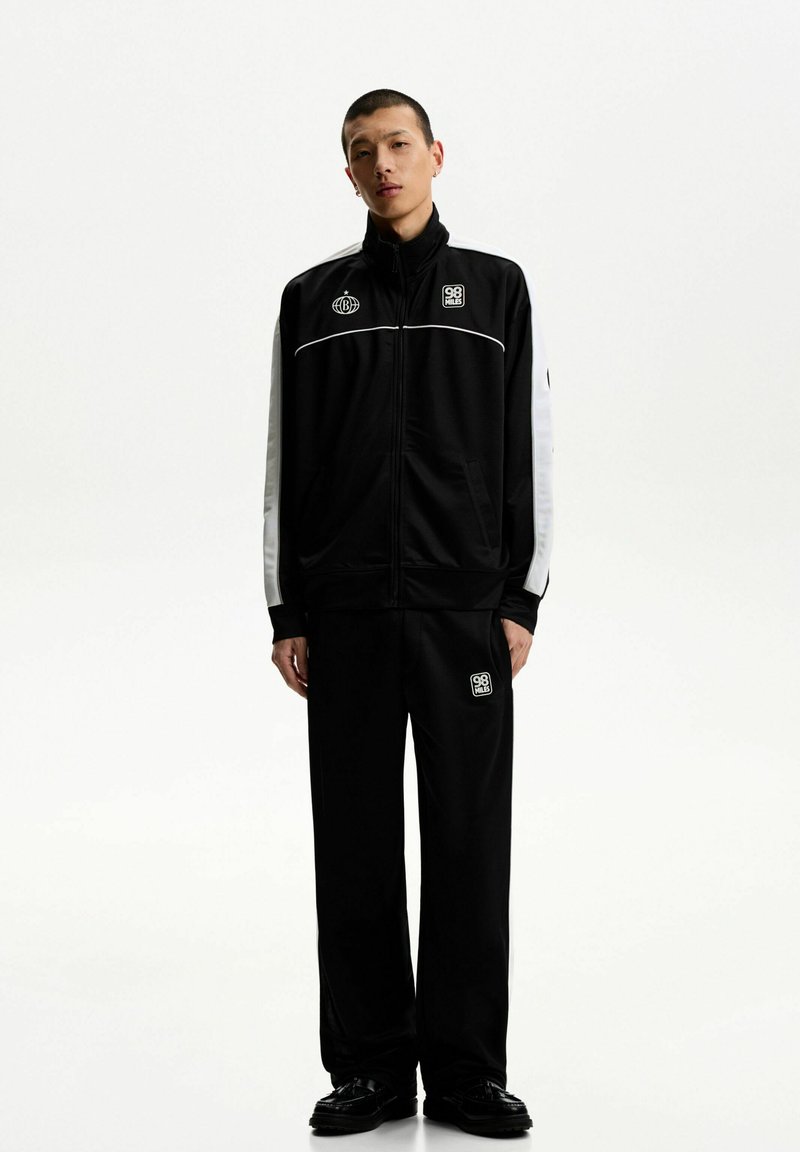 Bershka Tracksuit bottoms - black - Zalando.ie