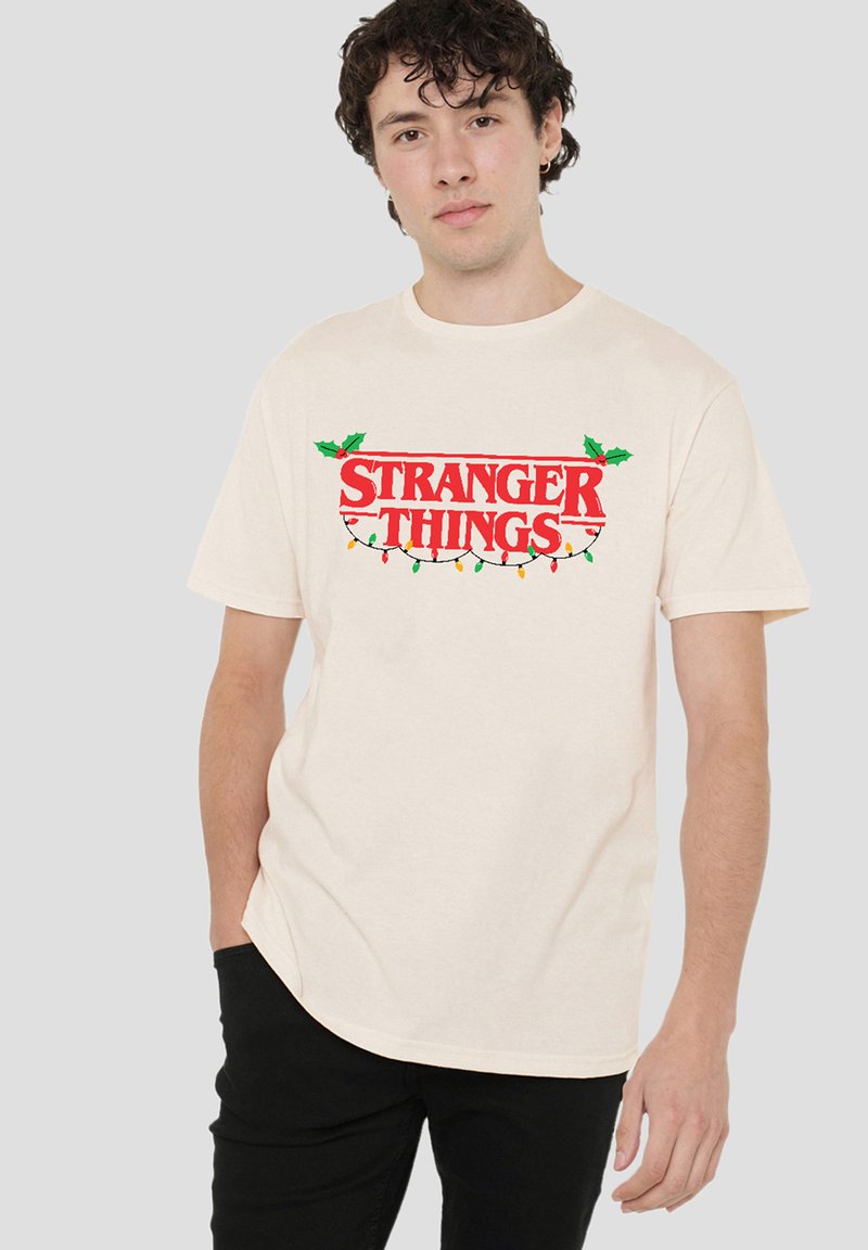 NETFLIX STRANGER THINGS CHRISTMAS LOGO - Print T-shirt - off-white ...