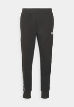 EA7 Emporio Armani TROUSER - Pantalon de survêtement - nero/noir - ZALANDO.BE
