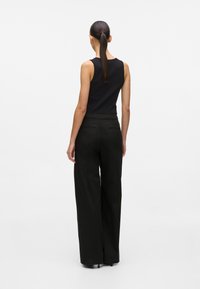 KARL LAGERFELD AMBER VALLETTA STRUCTURED - Trousers - black - Zalando
