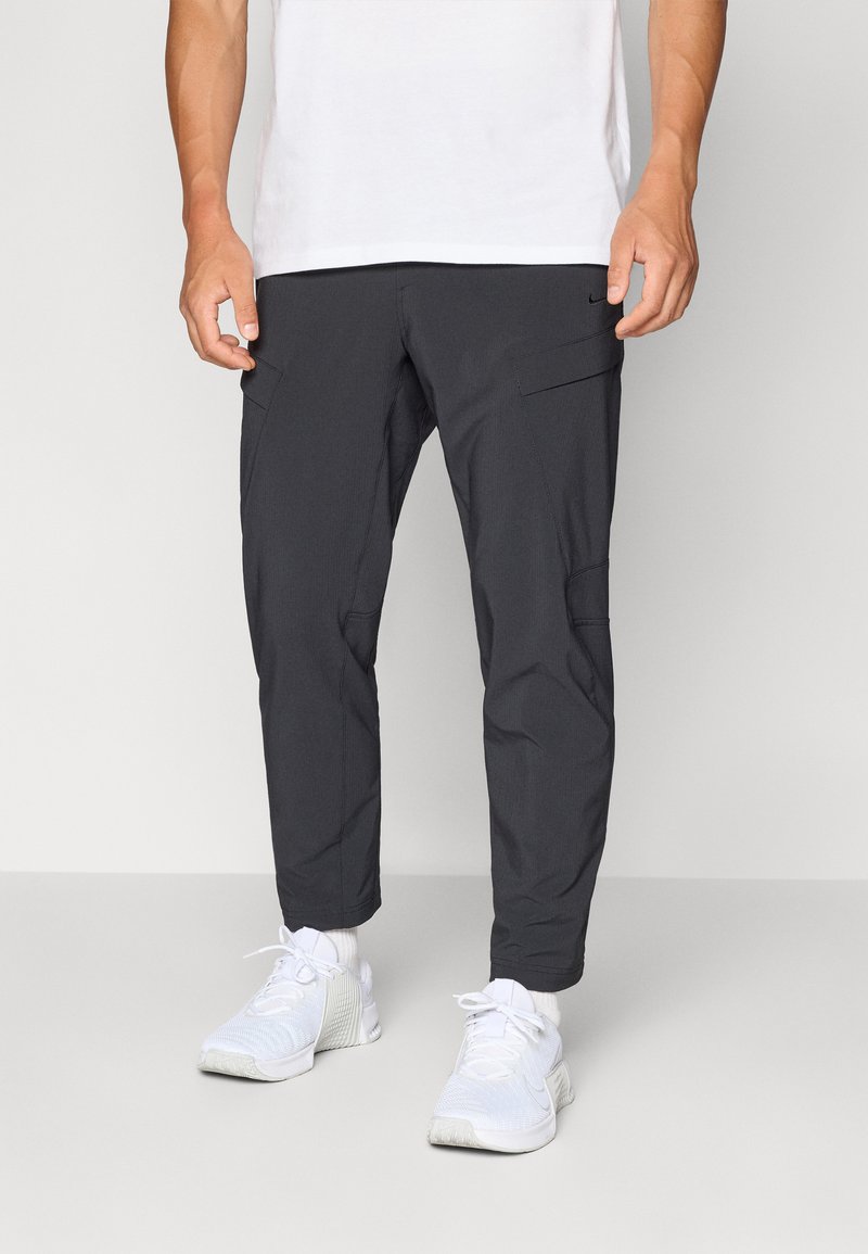 Nike Performance - Długie spodnie trekkingowe/czarny - Zalando.pl