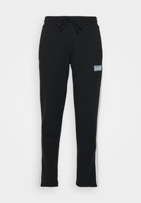 Puma SPONGEBOB PANTS - Tracksuit bottoms - black - Zalando.ie