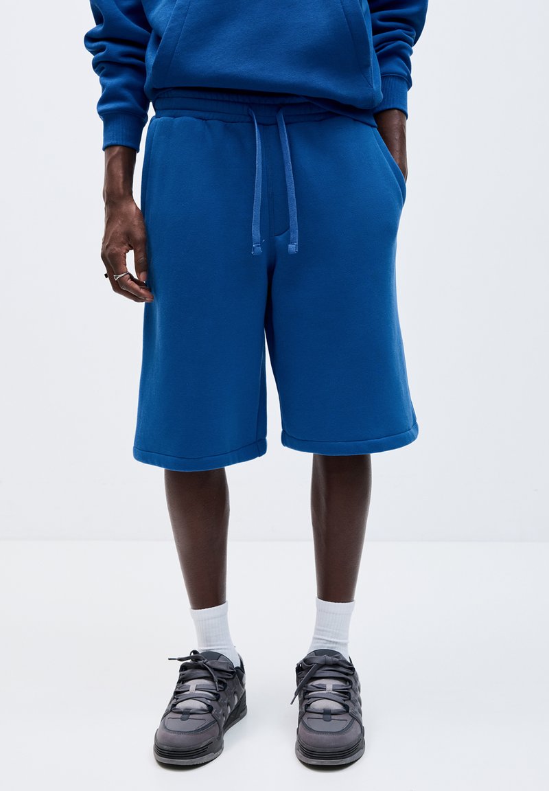 PULL&BEAR BERMUDA - Spodnie treningowe/niebieski - Zalando.pl