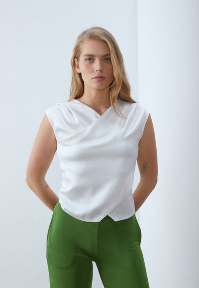 Avasta Tuunikad ja pluusid naistele veebis | ZALANDO