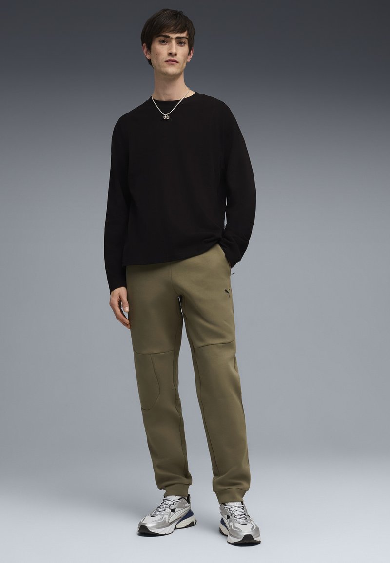Puma TECH JOGGING - Tracksuit bottoms - loden green/green - Zalando