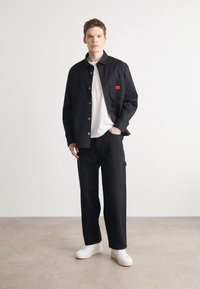 HUGO CARPENTER - Relaxed fit jeans - black - Zalando.ie