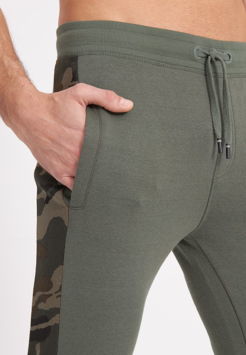 Bench KAPLIN - Tracksuit bottoms - khaki/green - Zalando.de