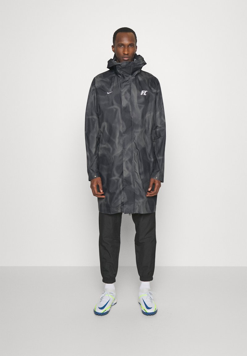 Nike Performance M NK RPL FC WVN PARKA GX - Impermeable - iron grey ...