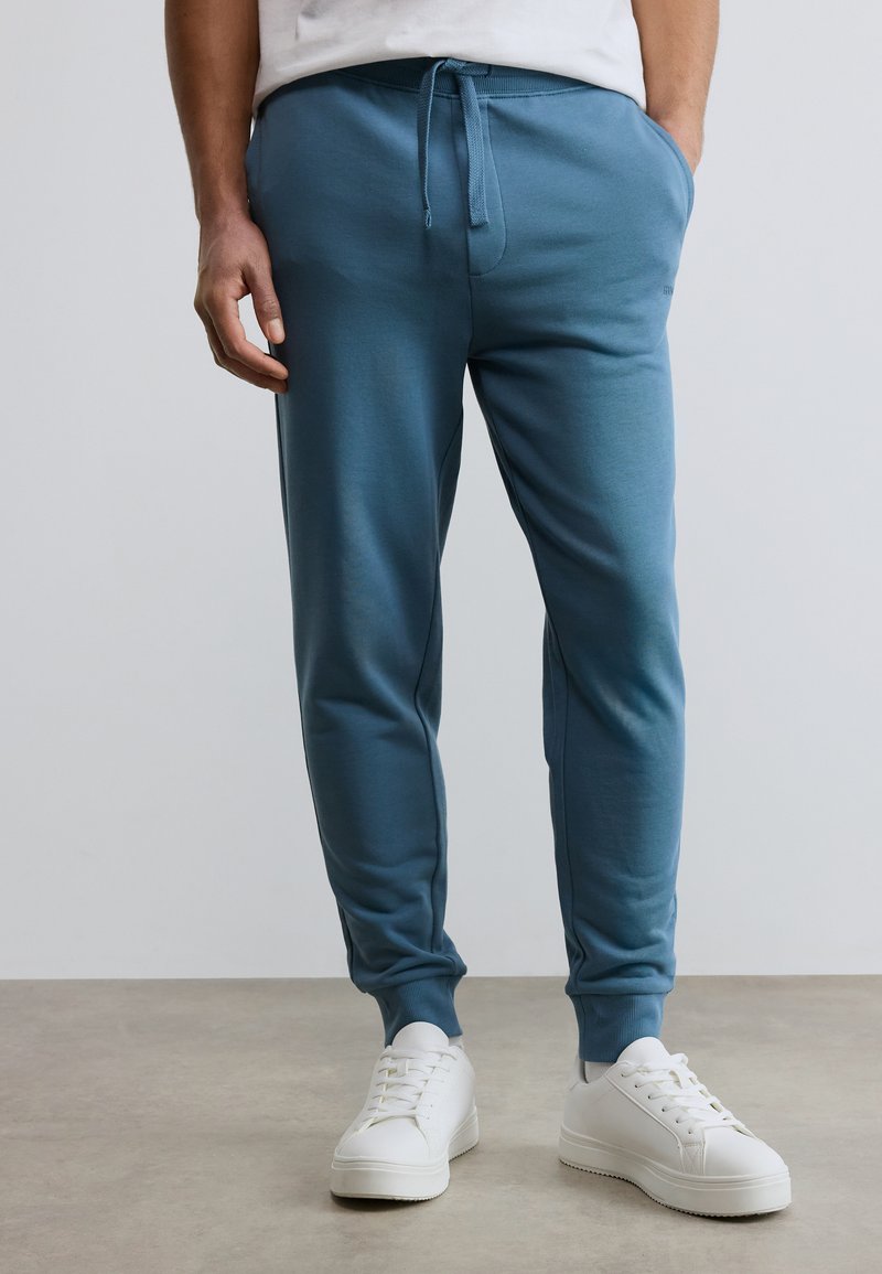 HUGO DAYOTE - Tracksuit bottoms - open blue/blue - Zalando