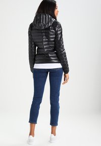 adidas Performance VARILITE - Down jacket - black - Zalando.co.uk