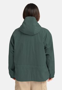 Jack Wolfskin FIND THE WILD 2L W - Waterproof jacket - sago palm/green ...