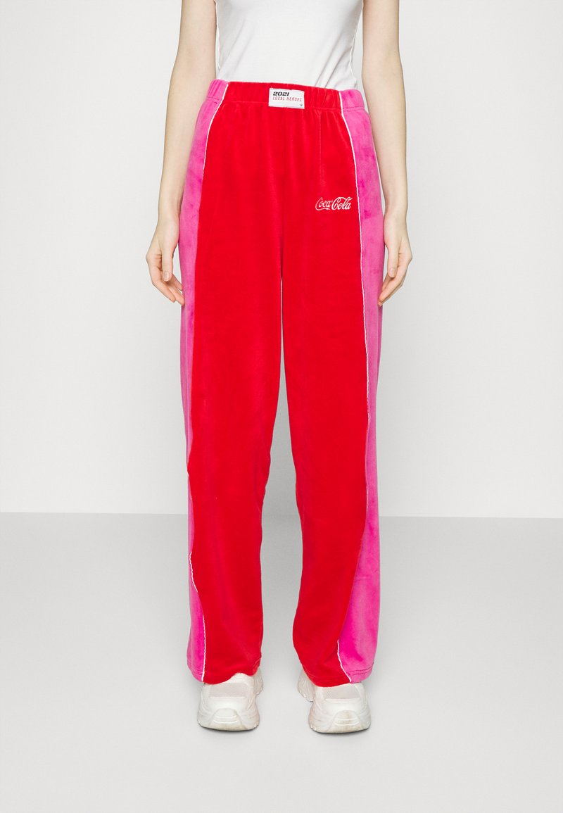 Local Heroes COCA COLA PANTS - Tracksuit bottoms - pink/red/pink ...