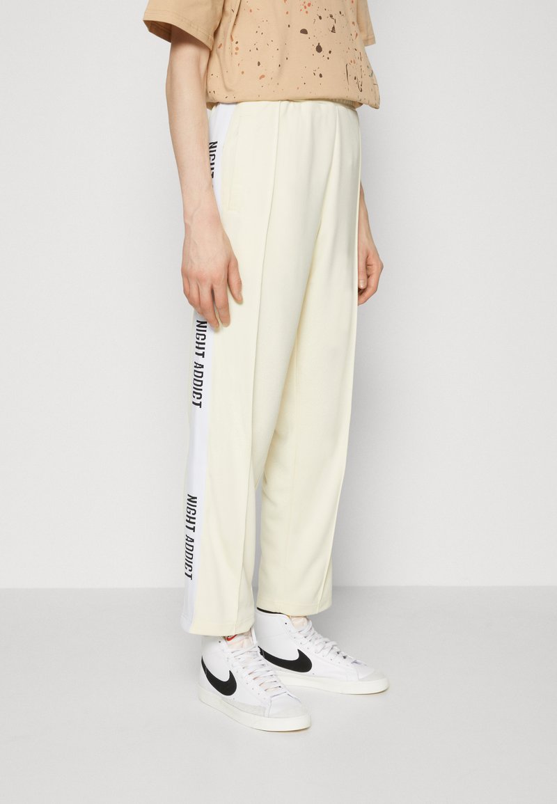 Night Addict UNISEX - Trainingsbroek - cream/beige - Zalando.nl