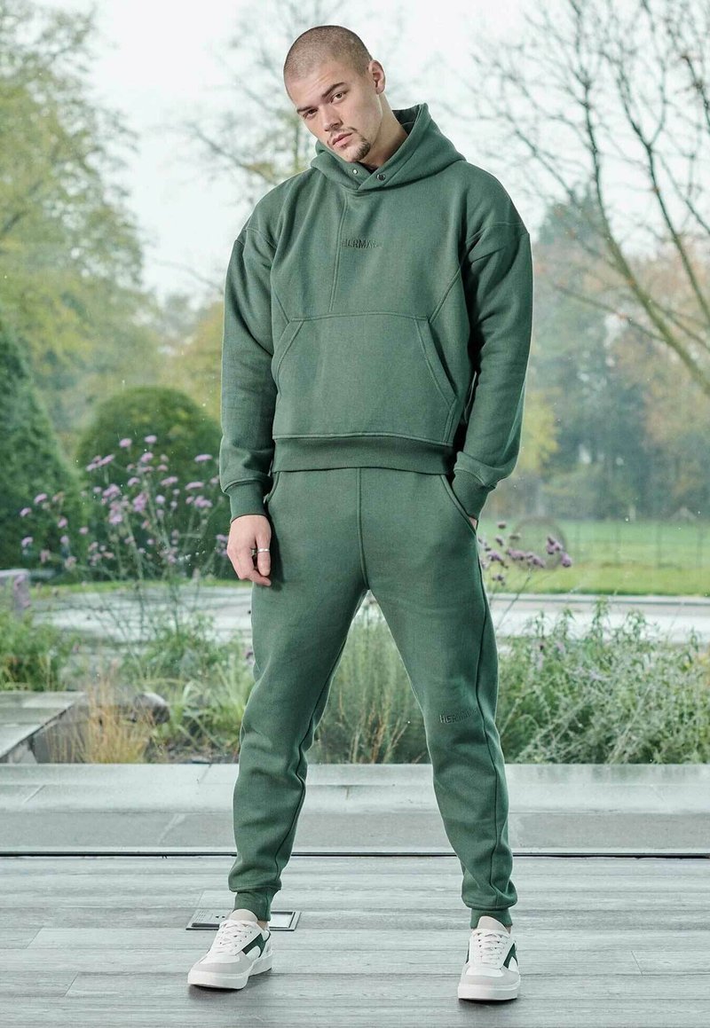 HERMAN&CO UNISEX - Tracksuit bottoms - dark green - Zalando.co.uk