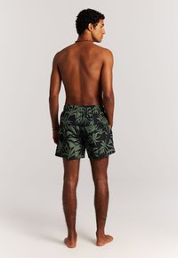 Protest PANTHER - Swimming shorts - true black/green - Zalando