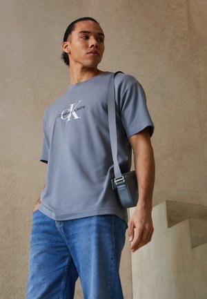 Calvin Klein Jeans MONOLOGO WASHED TEE UNISEX - T-shirt print - washed black/zwart - Zalando.nl