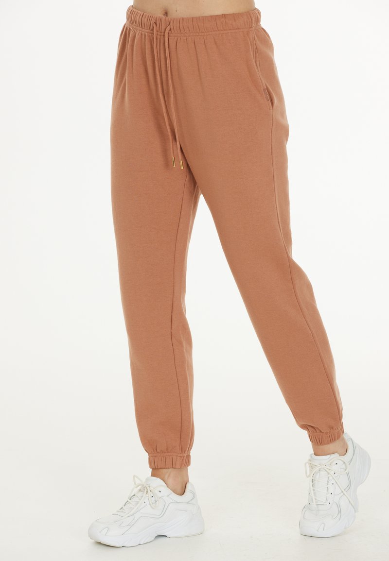 Athlecia SOFFINA - Tracksuit bottoms - mocha mousse/brown - Zalando.de
