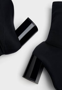 Bershka High heeled ankle boots - black - (Pre-owned) - Zalando