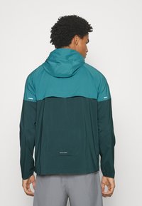 Nike Performance M NK WINDRUNNER JKT - Laufjacke - mineral teal/faded spruce/mint - Zalando.ch
