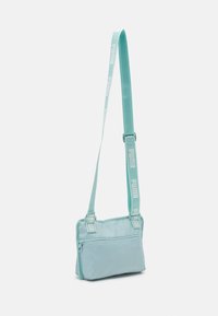 Puma CORE BASE SHOULDER BAG - Taška s příčným popruhem - turquoise surf ...
