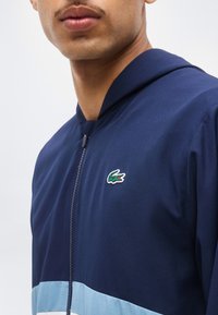 Lacoste Sport Tracksuit - navy blue/white/aral/dark blue - Zalando.co.uk