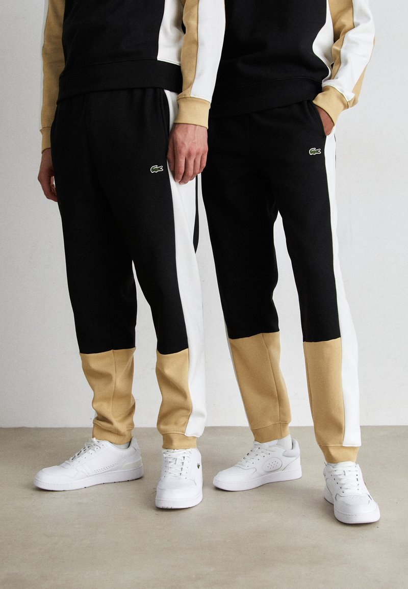 Lacoste UNISEX XH1300 SJ1 - Pantaloni de trening - noir/blanc/beige/bej ...